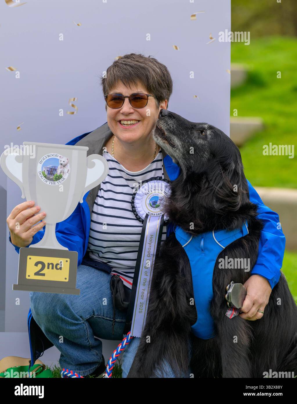 EDITORIAL USE ONLY Tess White MSP with her flat coated retriever, Kura ...