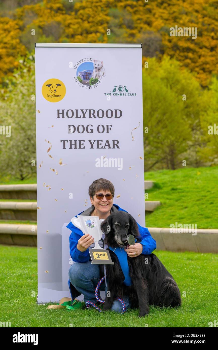 EDITORIAL USE ONLY Tess White MSP with her flat coated retriever, Kura ...