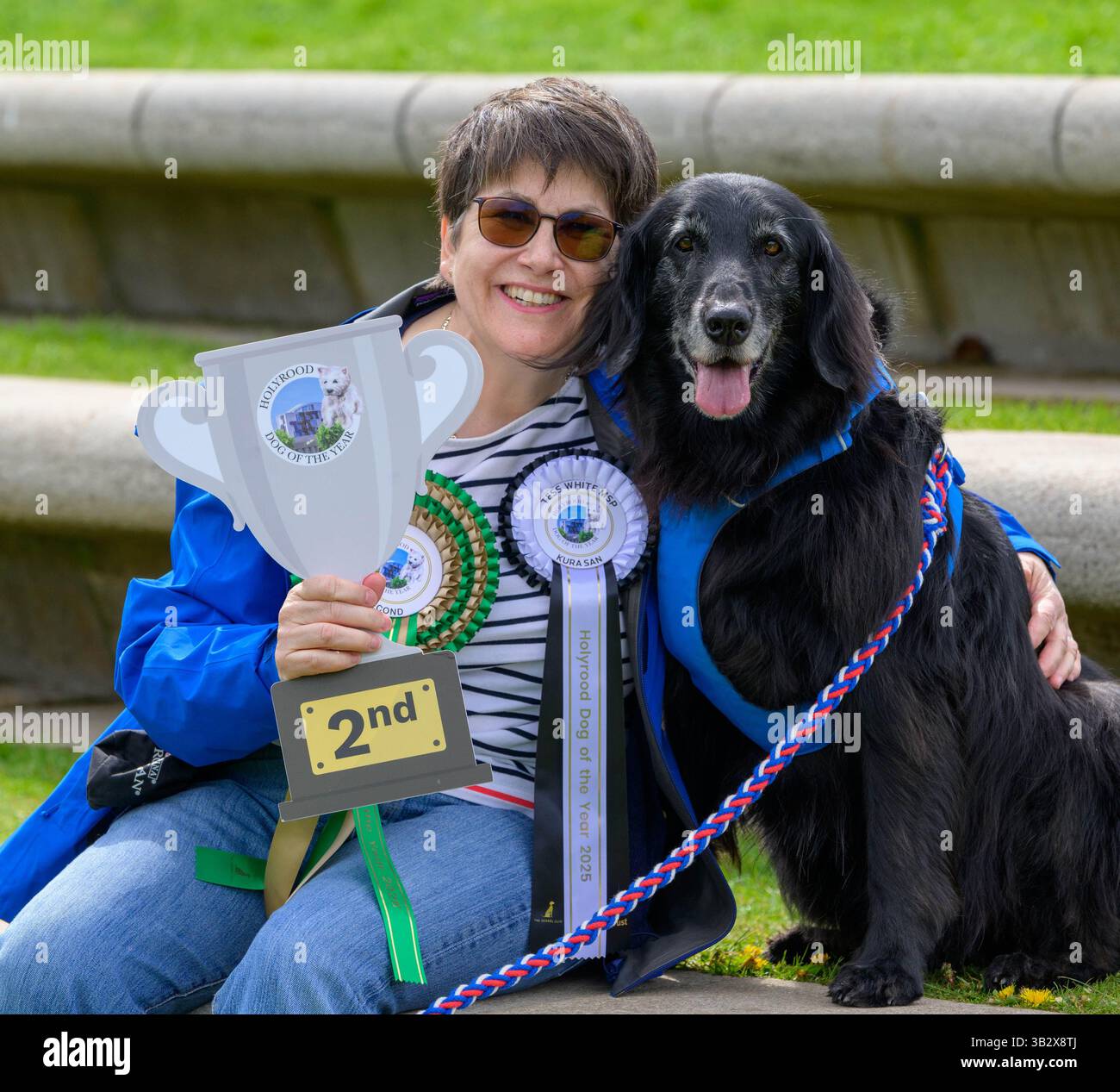 EDITORIAL USE ONLY Tess White MSP with her flat coated retriever, Kura ...