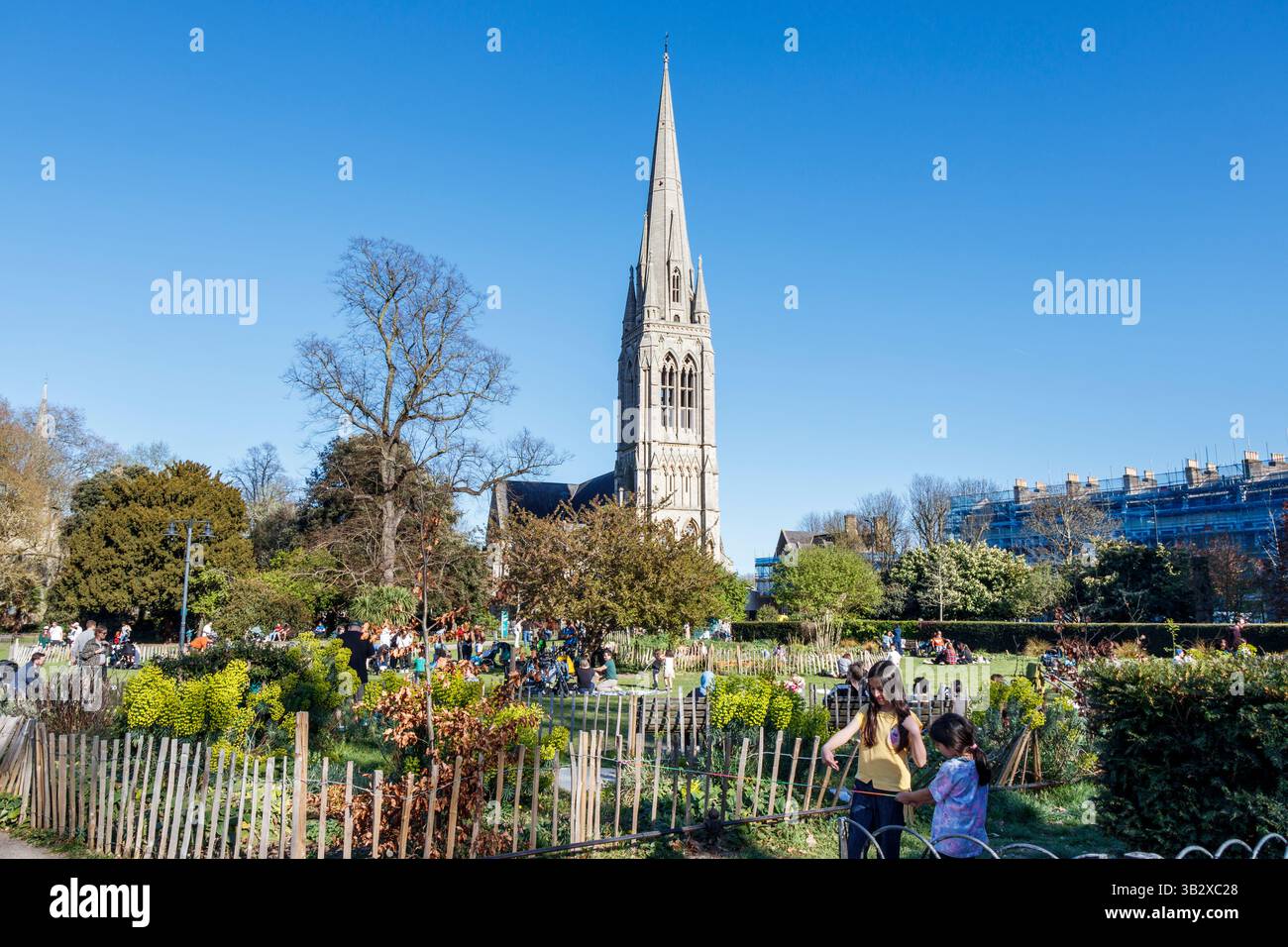 The tower and spire of St. Mary's Church in Stoke Newington seen across Clissold Park, Hackney ...