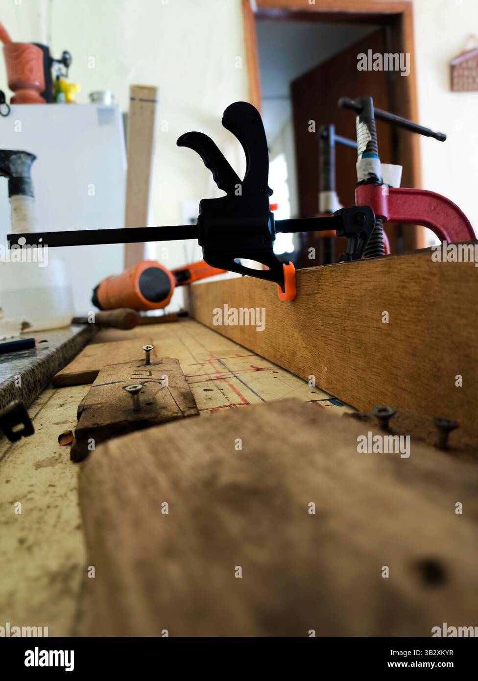 Set of clamps for gluing wood Stock Photo - Alamy