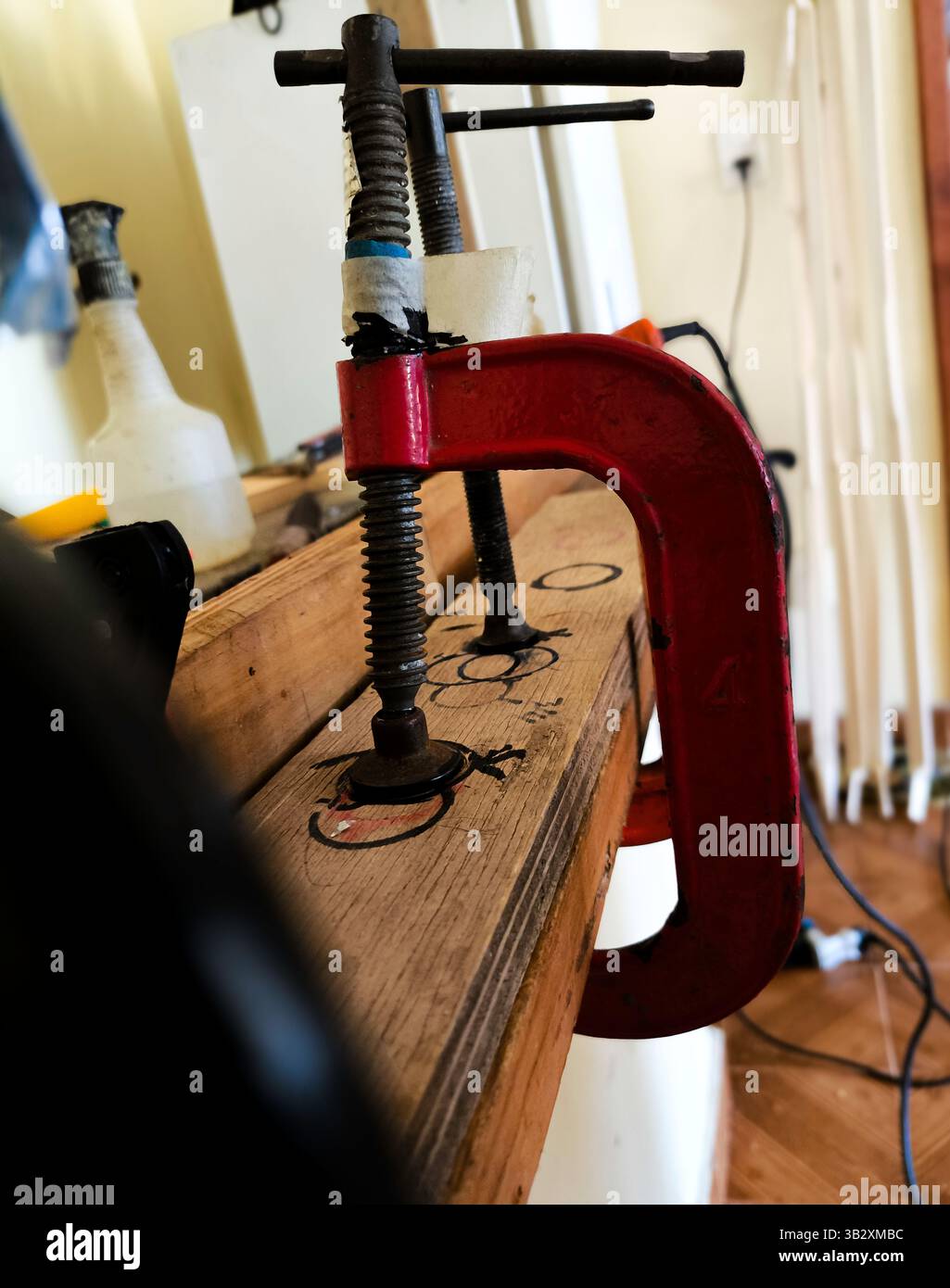 Set of clamps for gluing wood Stock Photo - Alamy