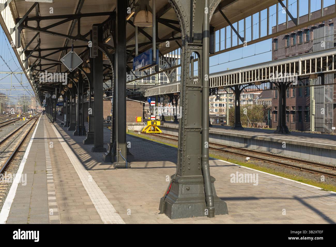 Close-up of a classic railway platform with iron columns and canopies ...