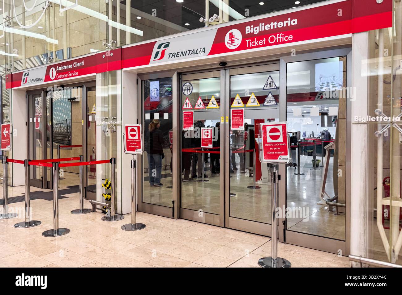 Milan, Italy - April, 07, 2025: Trenitalia ticket office entrance with ...