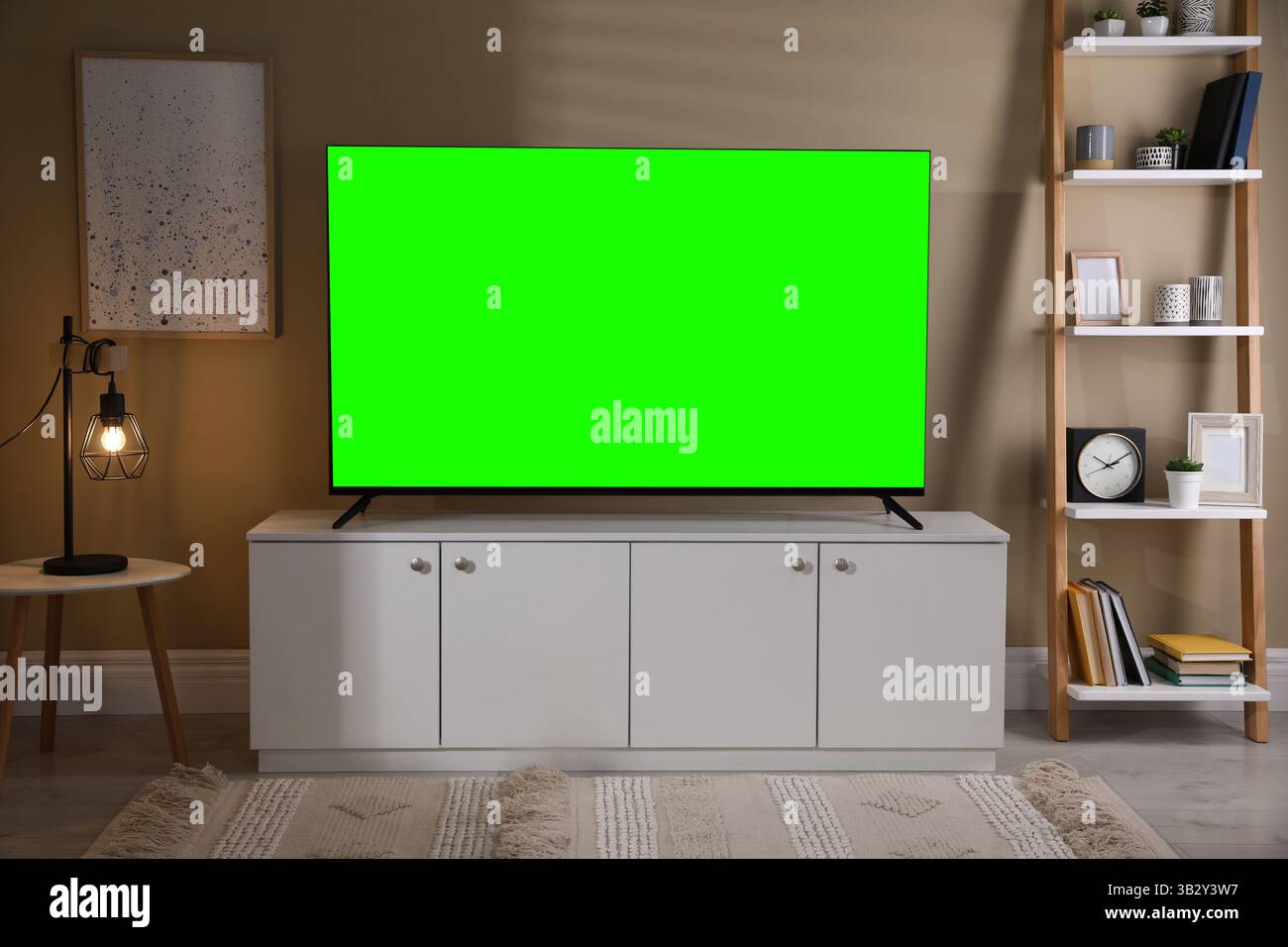 Modern TV set with green screen in living room. Chroma key compositing ...