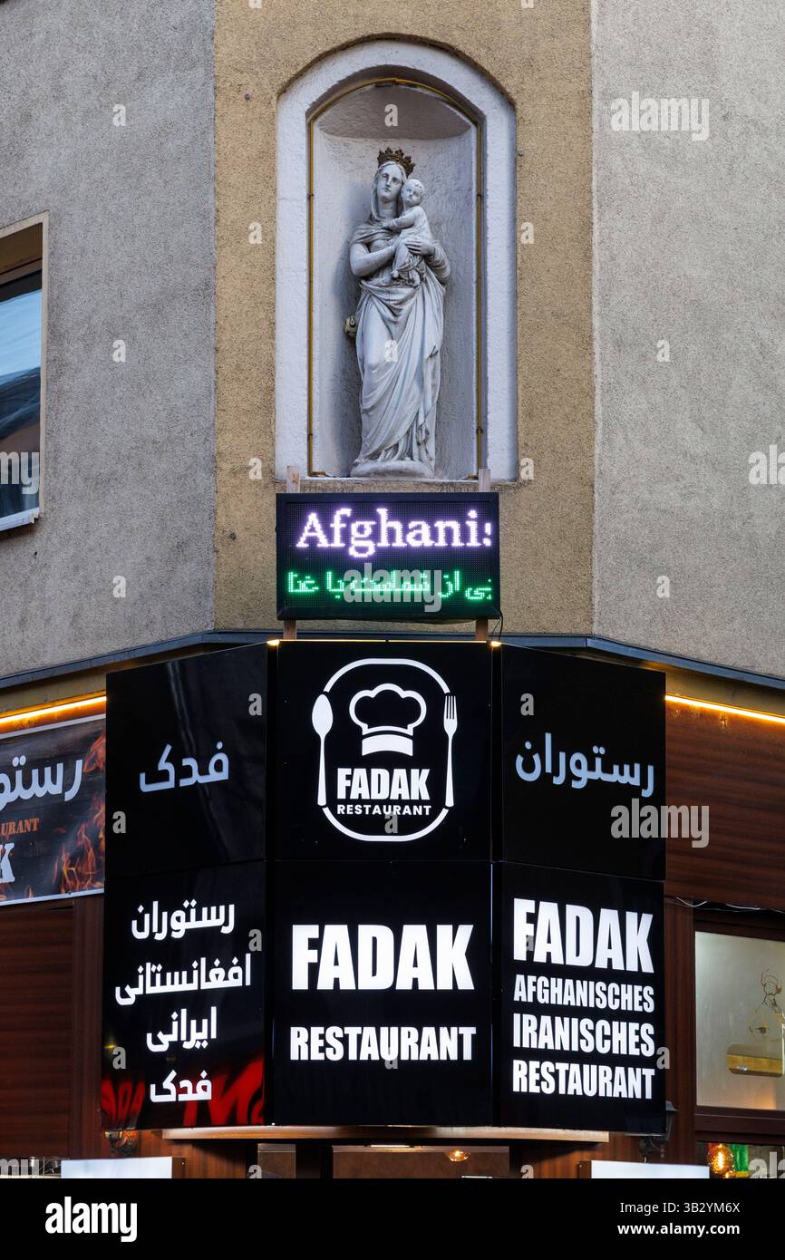 Virgin Mary on the corner of a house above an Afghan-Iranian restaurant ...