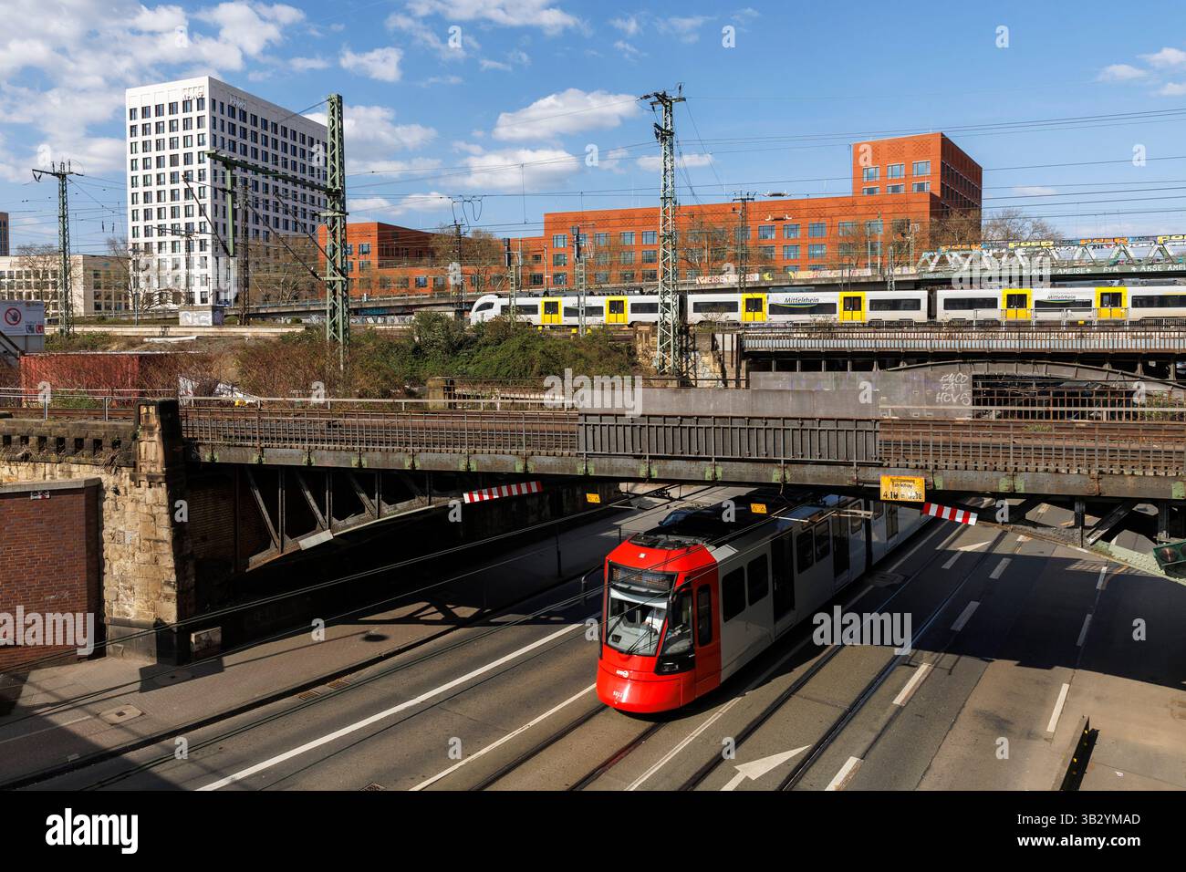 TransRegio MittelrheinBahn train and tram on Deutz-Muelheimer street in ...
