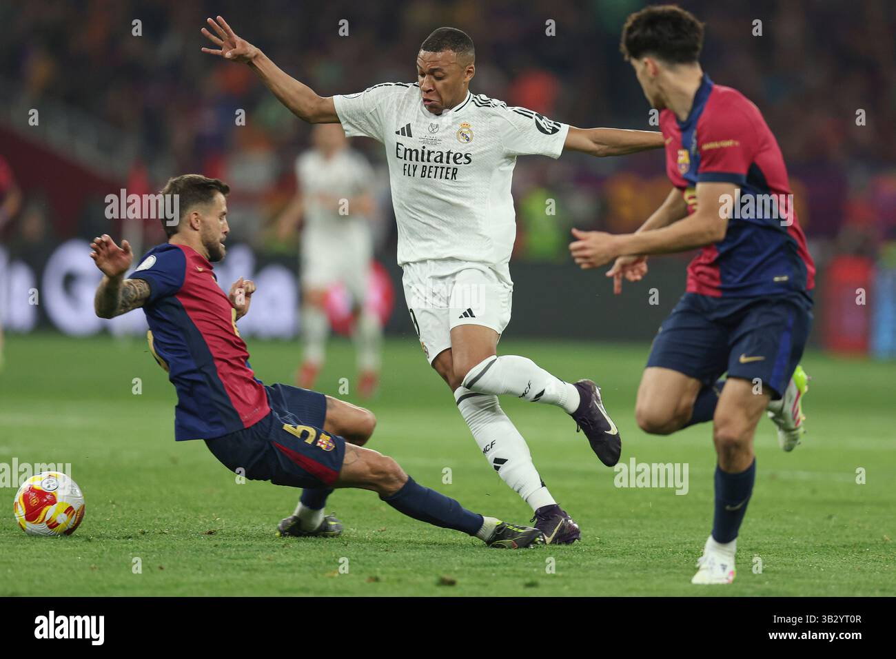 Kylian Mbappe of Real Madrid and Inigo Martinez of FC Barcelona during ...