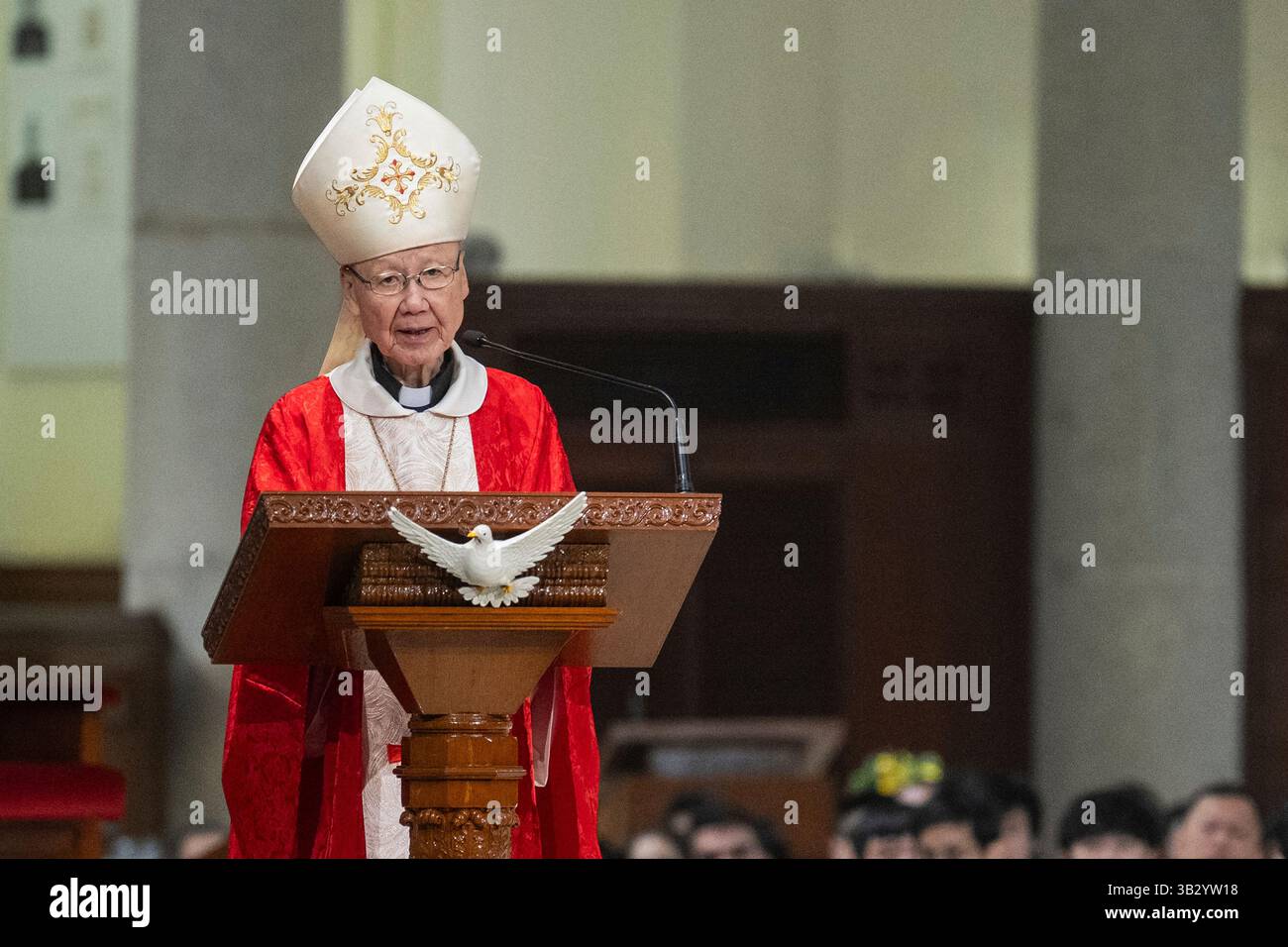 Cardinal John Tong Hon reads a homily during a memorial Mass for the ...