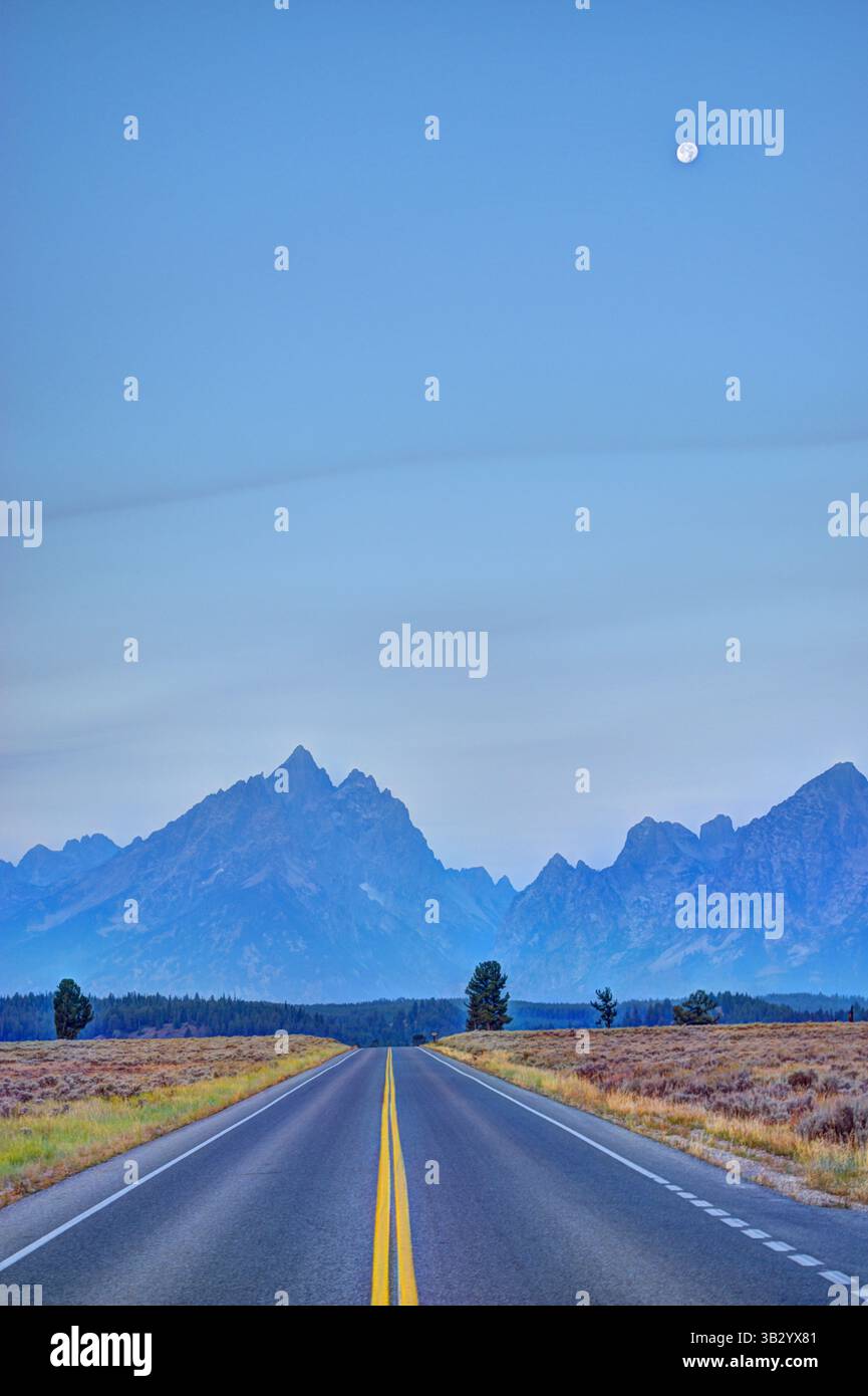 Straight Road Through Grand Tetons National Park, In The Morning With ...