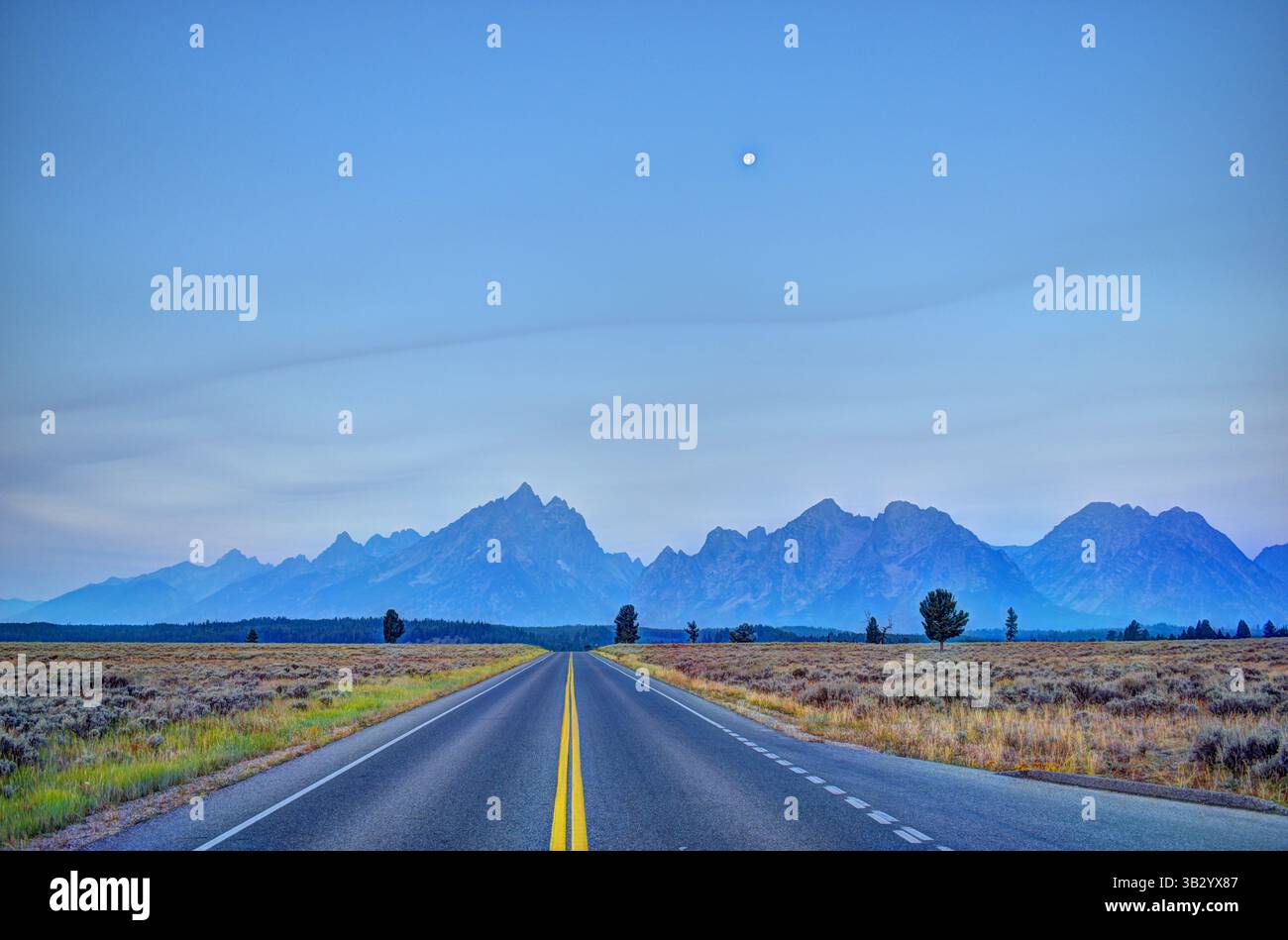 Straight Road Through Grand Tetons National Park, In The Morning With ...