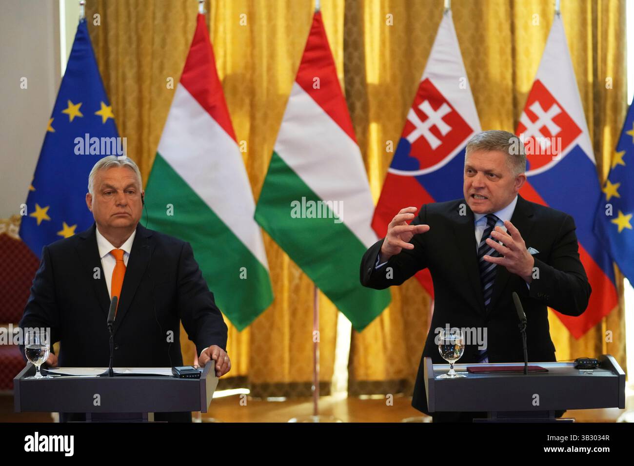 Slovakia's Prime Minister Robert Fico, right, and his Hungarian ...