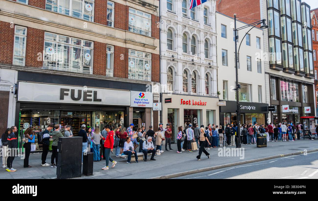 London, UK. 28th Apr, 2025. Runners queue to get their finisher medals ...
