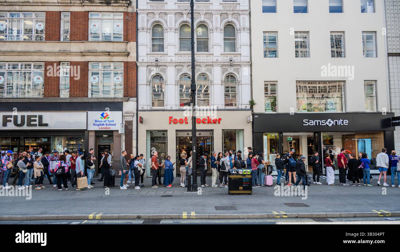 London, UK. 28th Apr, 2025. Runners queue to get their finisher medals ...