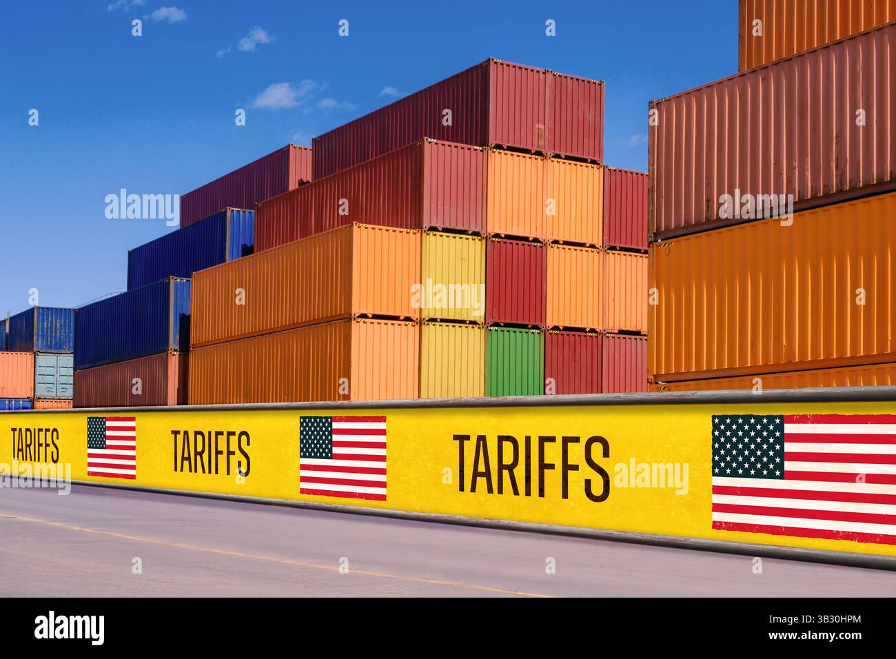 Stacked shipping containers behind tariff barriers with US flags ...