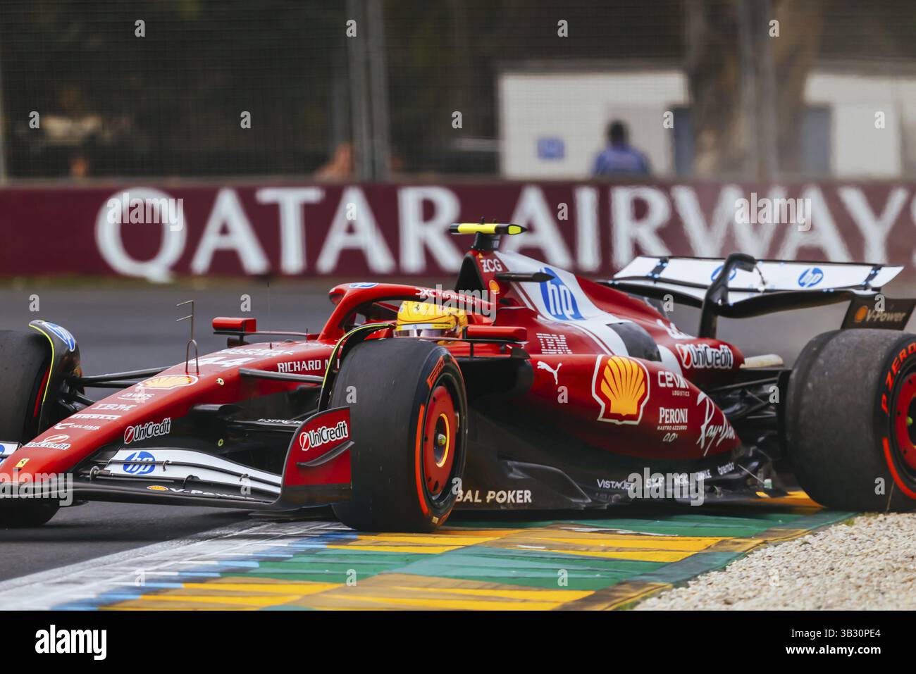 MELBOURNE, AUSTRALIA - MARCH 15: Lewis Hamilton of Great Britain spins ...