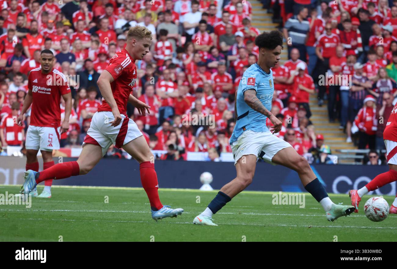 London, UK. 27th Apr, 2025. Nico O'Reilly of Manchester City and Zach ...