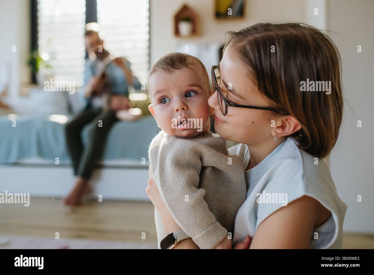 Big sister comforting sad baby brother Stock Photo - Alamy