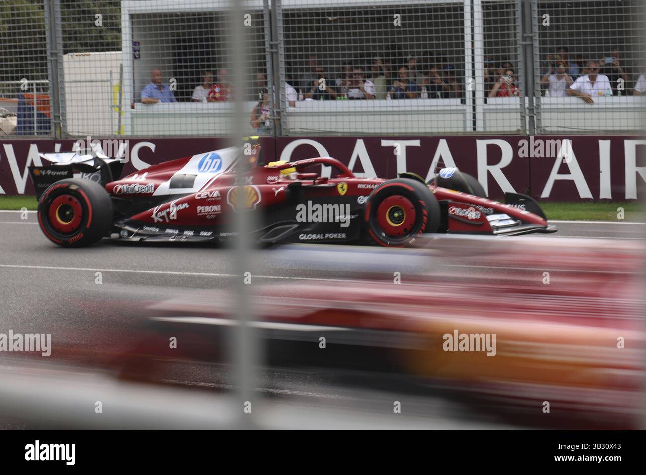 MELBOURNE, AUSTRALIA - MARCH 15: Lewis Hamilton of Great Britain spins ...