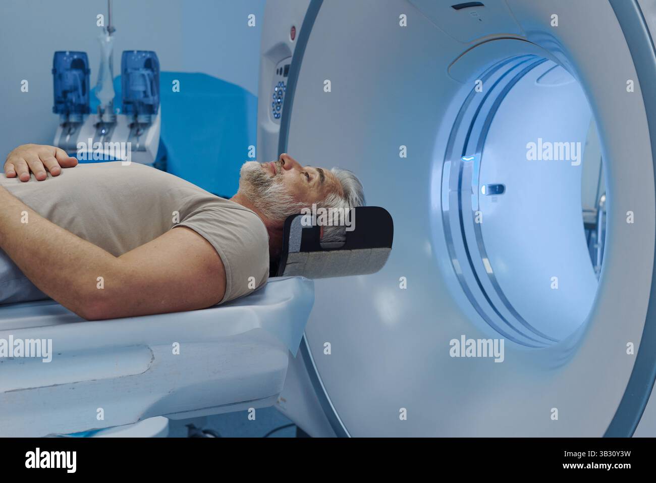 Male patient undergoing CT scan examination in hospital Stock Photo - Alamy