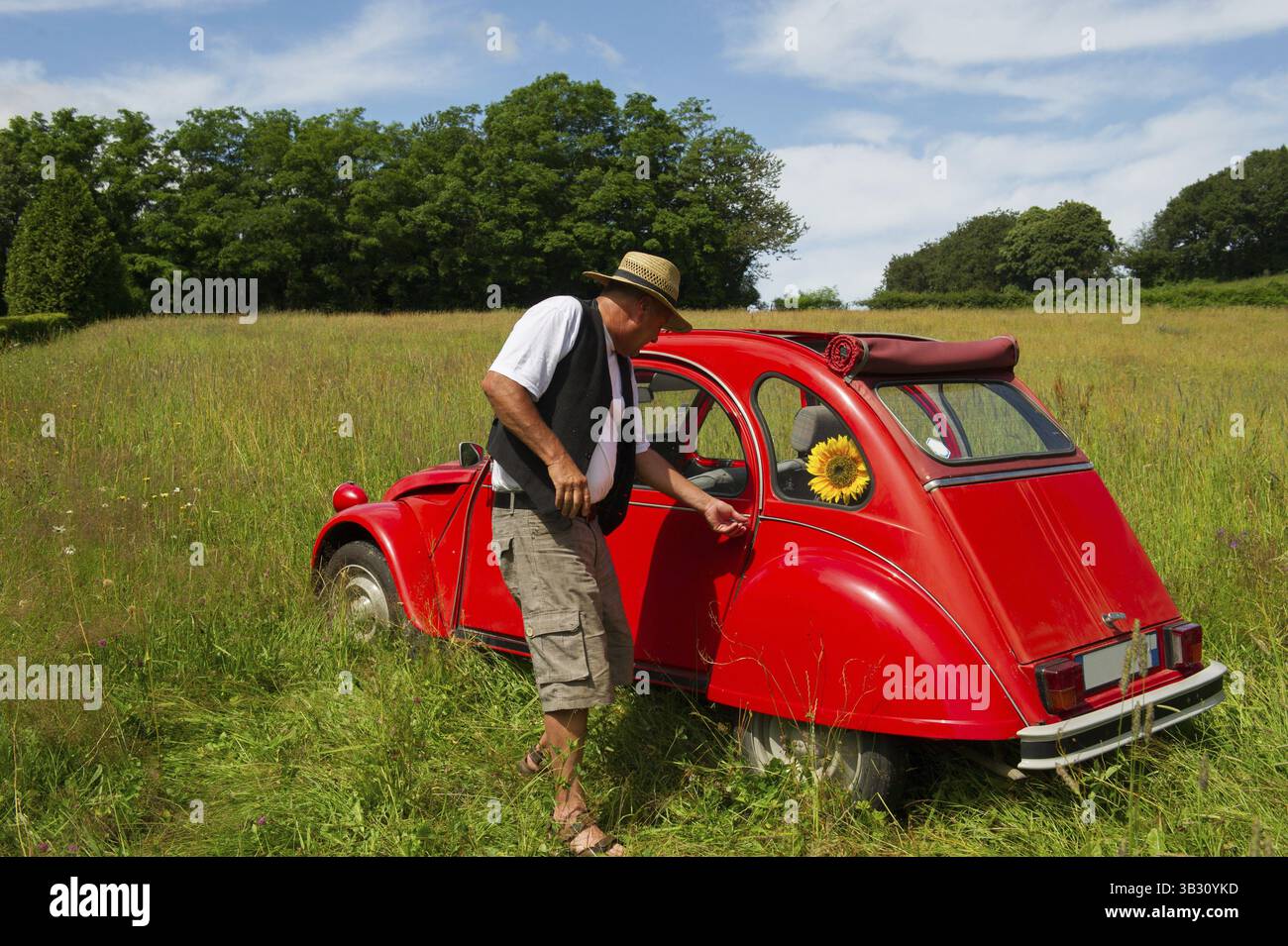 Typical French man is opening the door of his French car Stock Photo ...