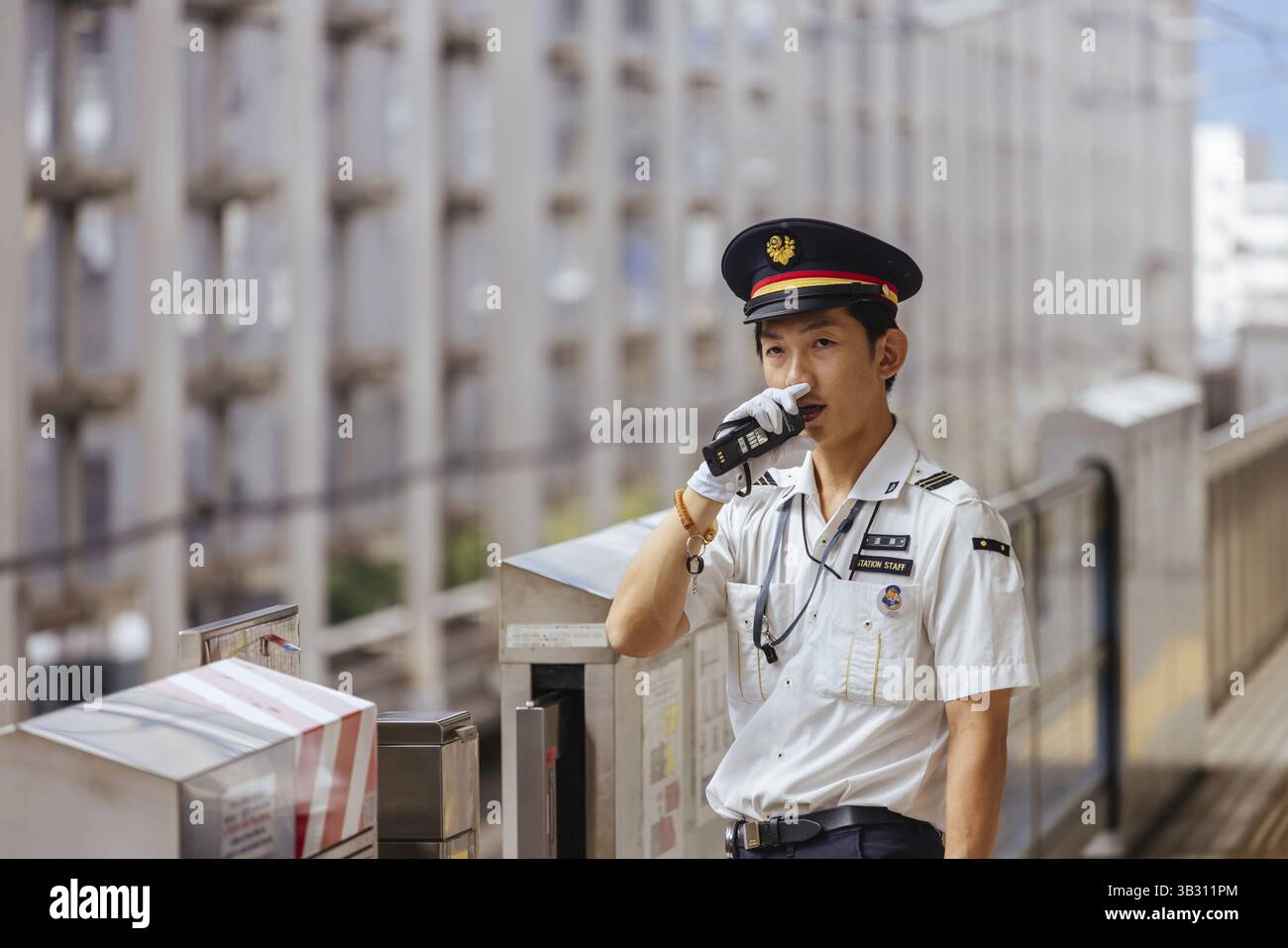 KYOTO, JAPAN - SEPTEMBER 24, 2024: Kyoto train station staff during ...