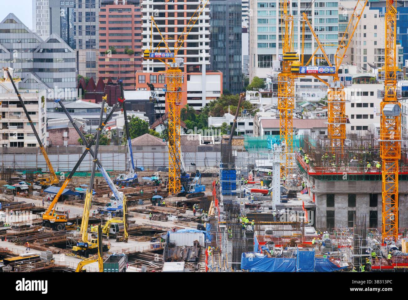 Bangkok, Thailand - April 28, 2025 : urban construction site with cranes, machinery, and workers ...