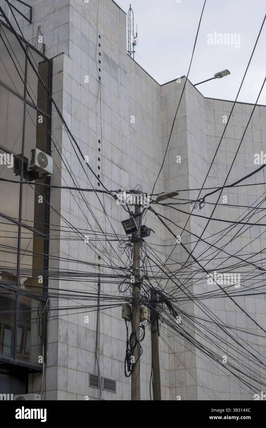 Chaotic installation of power and telecommunications cables on a ...
