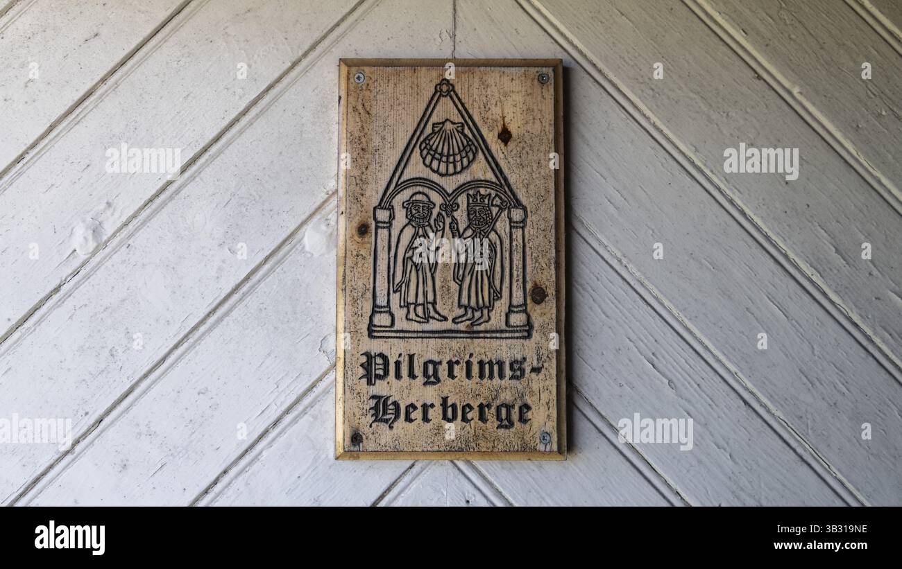 Wooden plaque with medieval drawing and the words 'Pilgrims Hostel' on ...