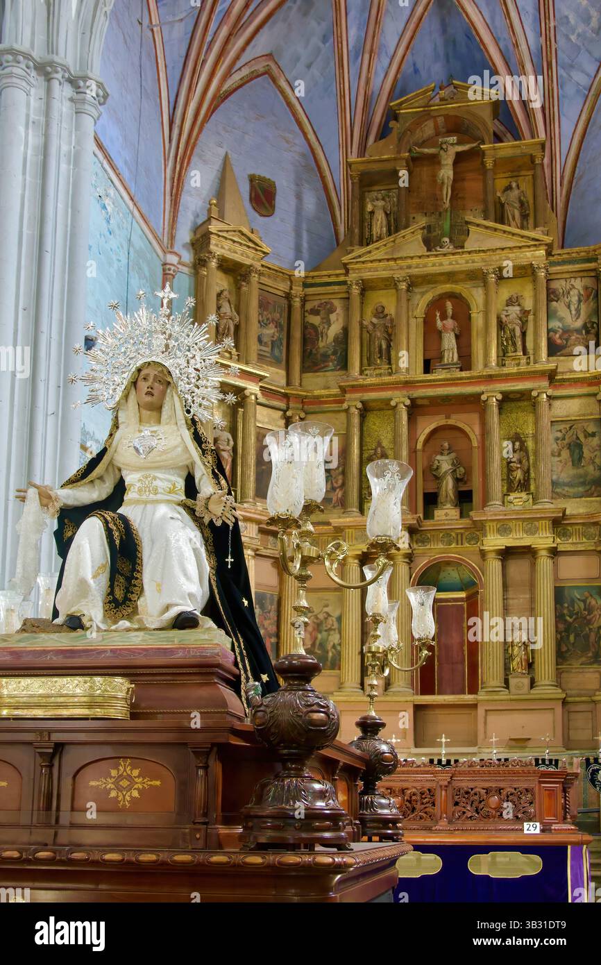 Paso with life-size wooden statue of a seated Virgin Mary with the main ...