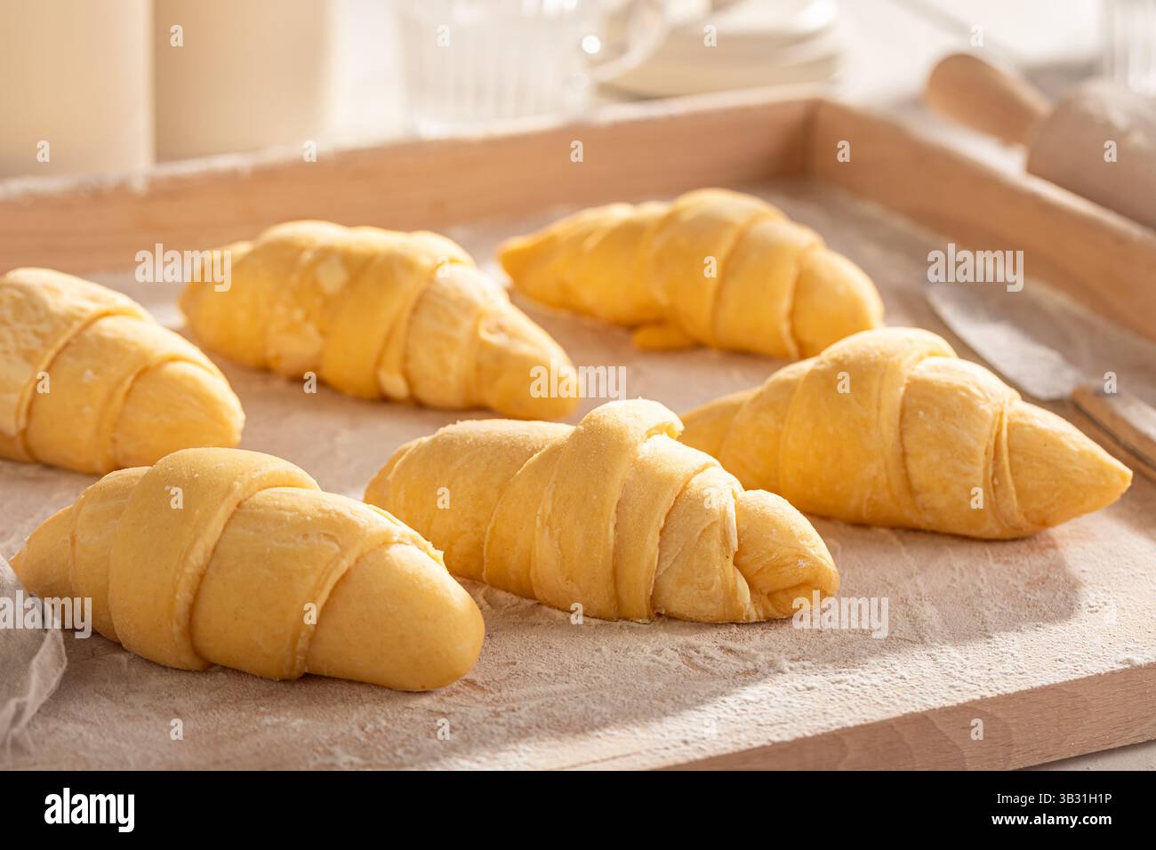 Delicious french croissants prepared on pastry board. Preparing ...