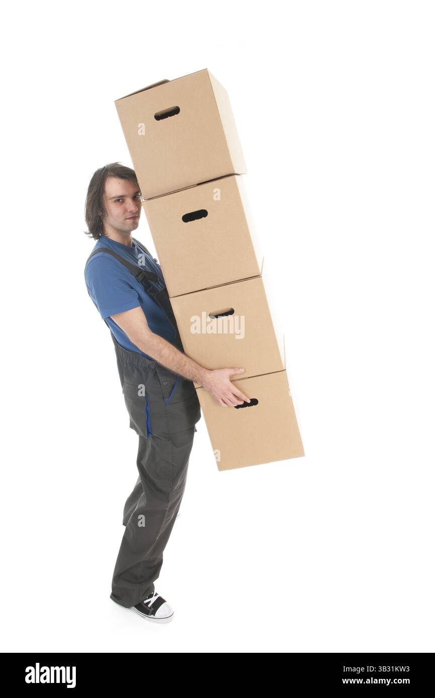 Mover with big stack of heavy boxes Stock Photo - Alamy