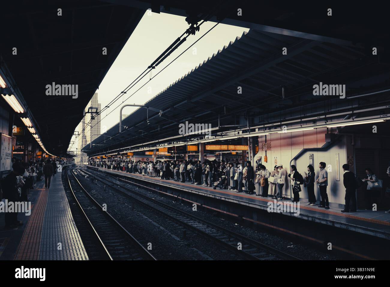 TOKYO, JAPAN - MAY 11, 2019: Shinjuku train station platform and ...