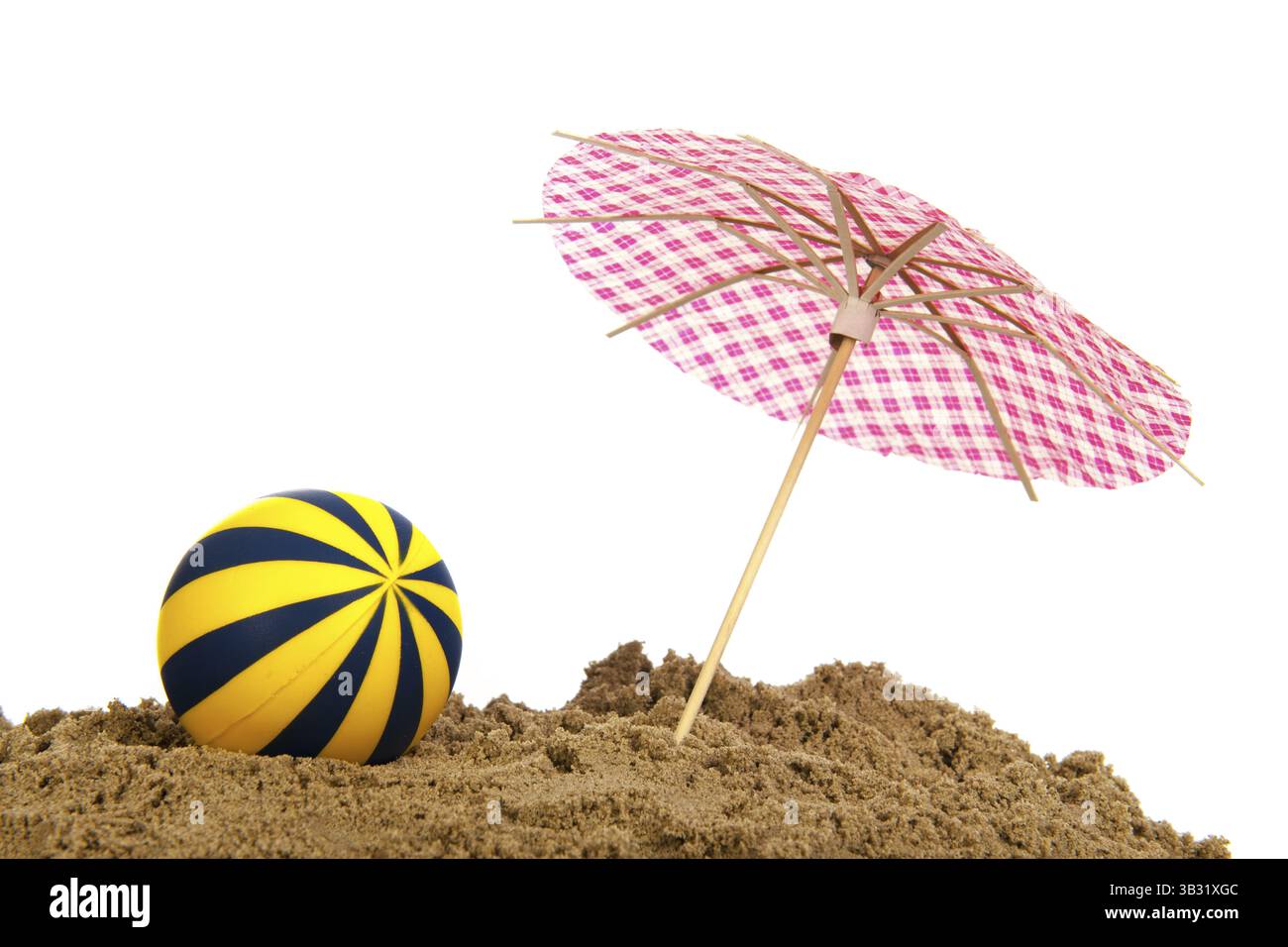 Concept beach with ball ald parasol in the sand Stock Photo - Alamy