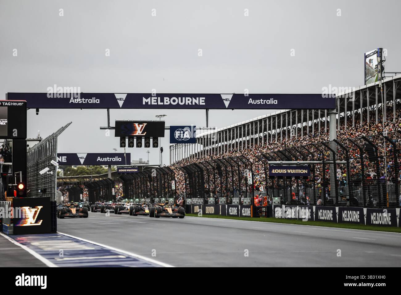 Lando Norris of Great Britain and McLaren Formula 1 Team leads at race start at the 2025 ...