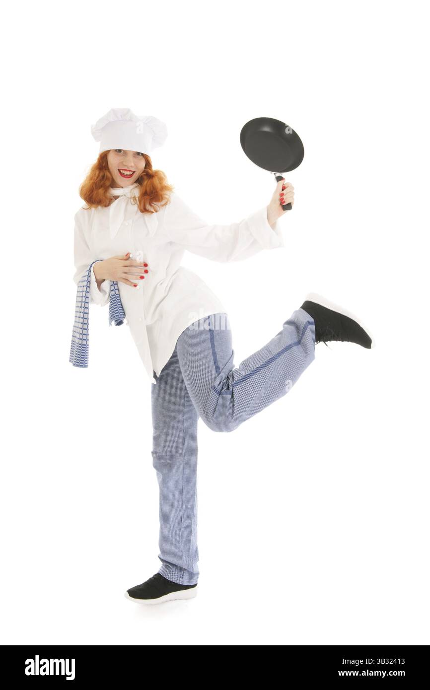 Young female chef having fun with frying pan Stock Photo - Alamy