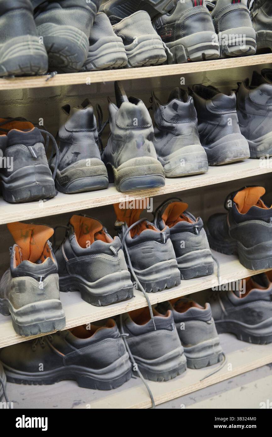 Many safety shoes in different sizes at a plant Stock Photo - Alamy