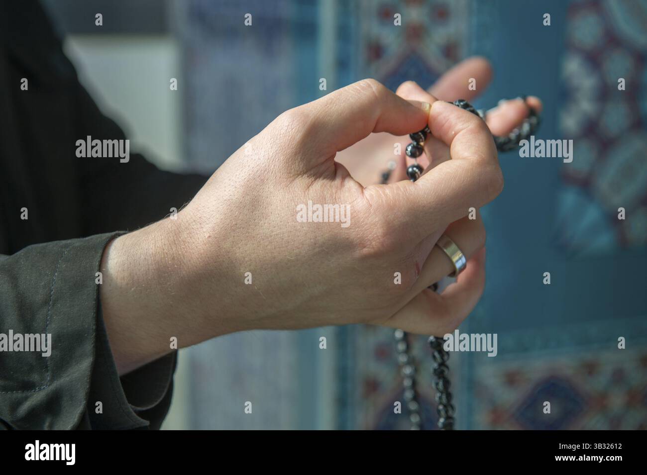 Islamic man praying with beads in the mosque Stock Photo - Alamy
