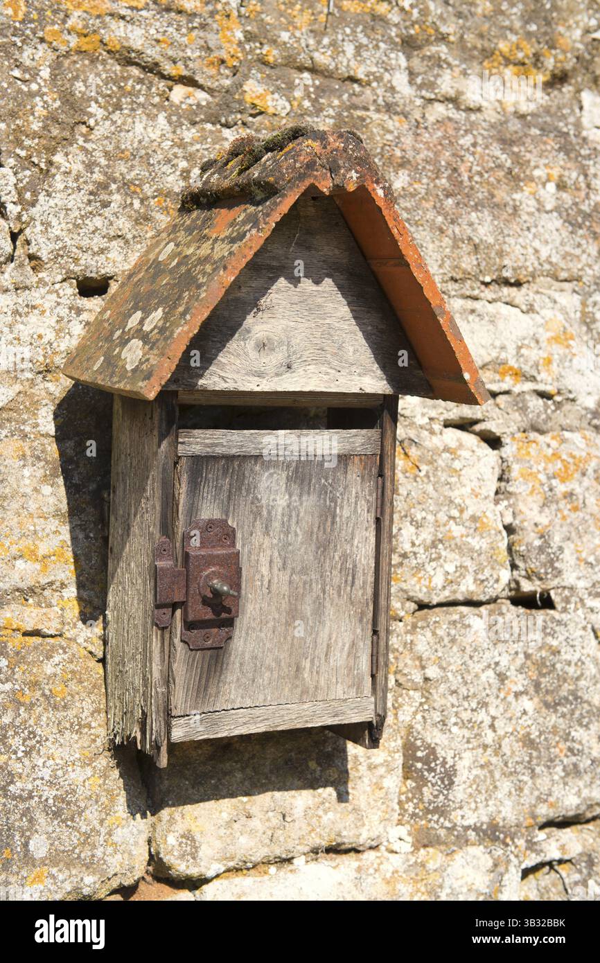 Old vintage letterbox hanging at the stone wall Stock Photo - Alamy