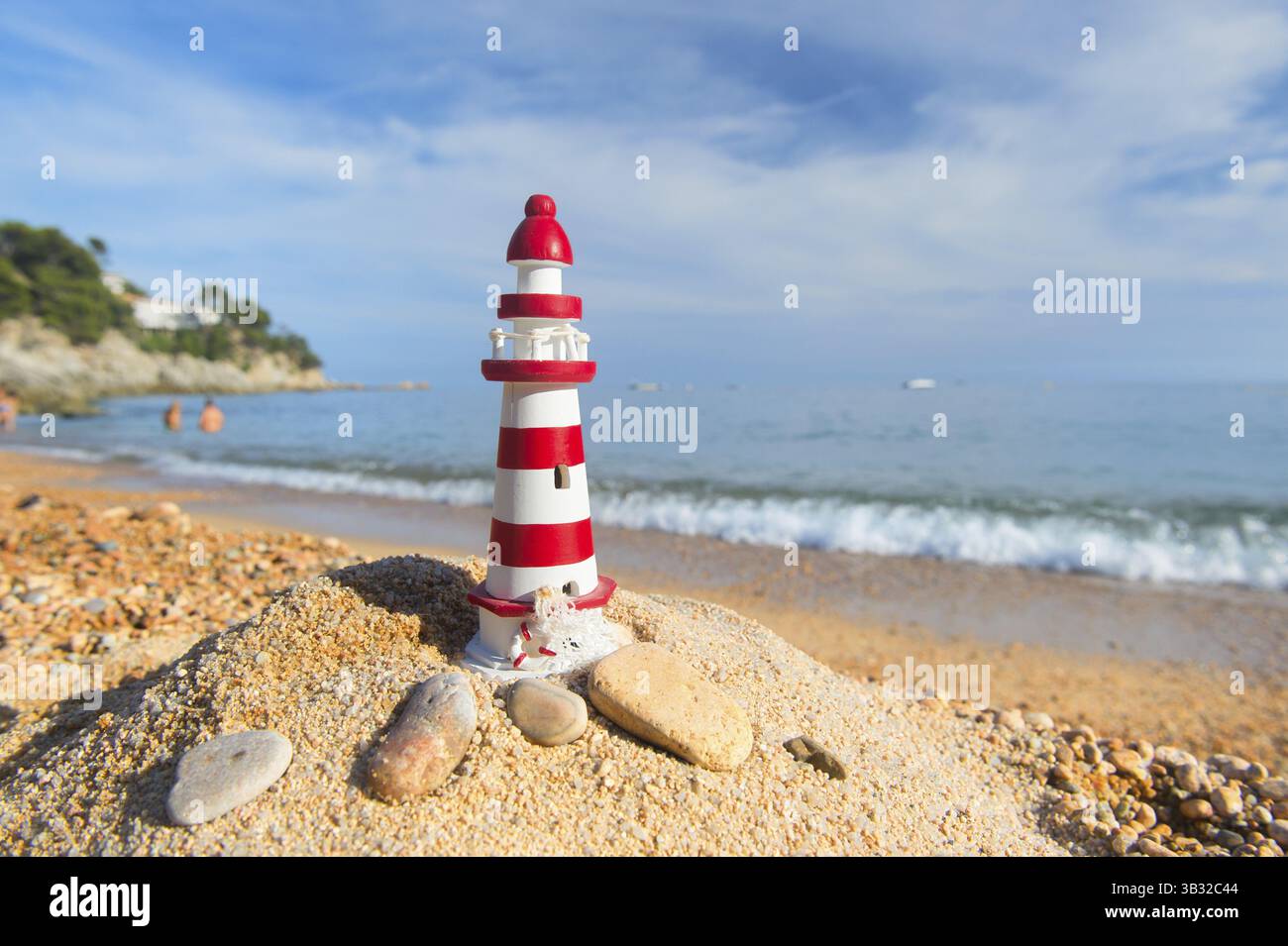 Miniature lighthouse at the beach Stock Photo - Alamy