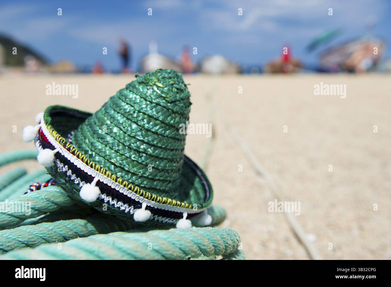 Green Spanish straw Sombrero in sand at the beach Stock Photo - Alamy