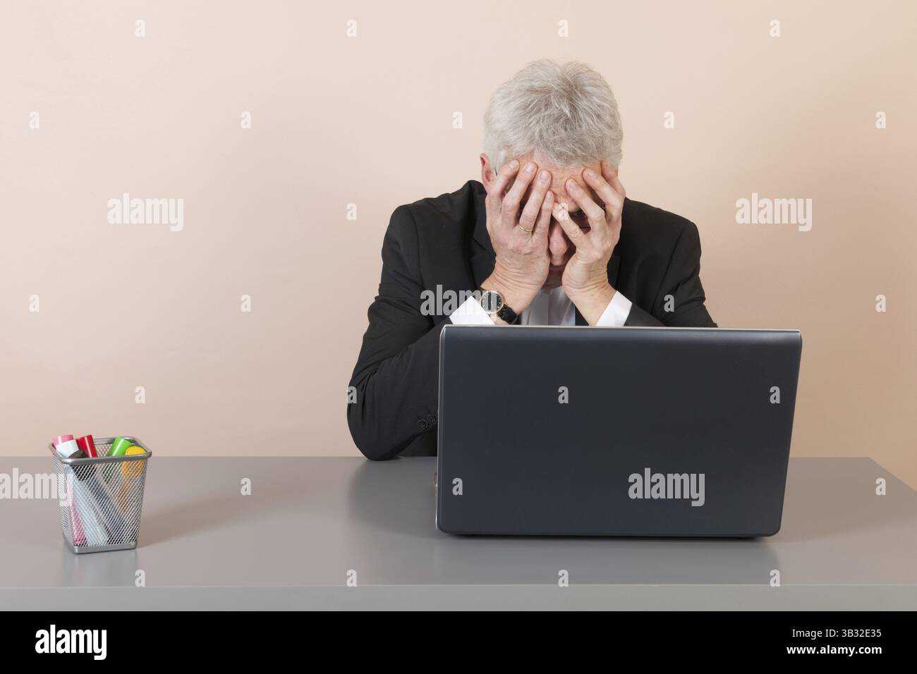 Senior man worried while working with laptop at the office Stock Photo ...
