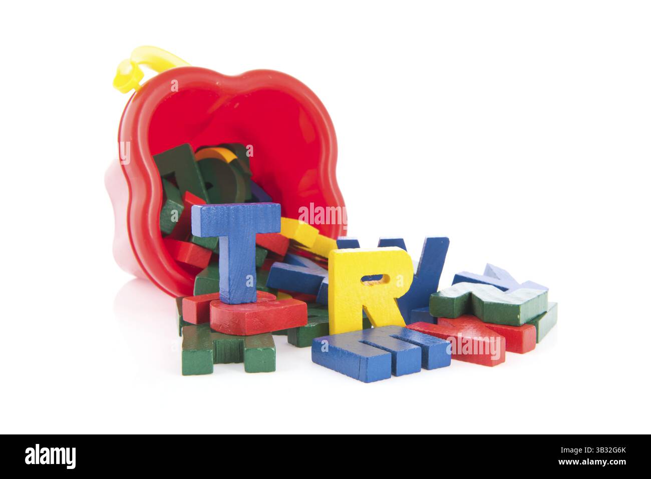 Many vintage wooden letters in toy bucket isolated over white ...