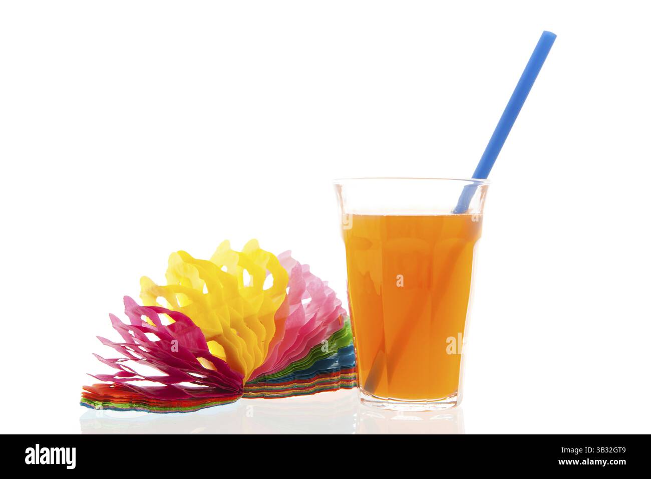 Glass orange lemonade and paper chain for child party isolated over ...