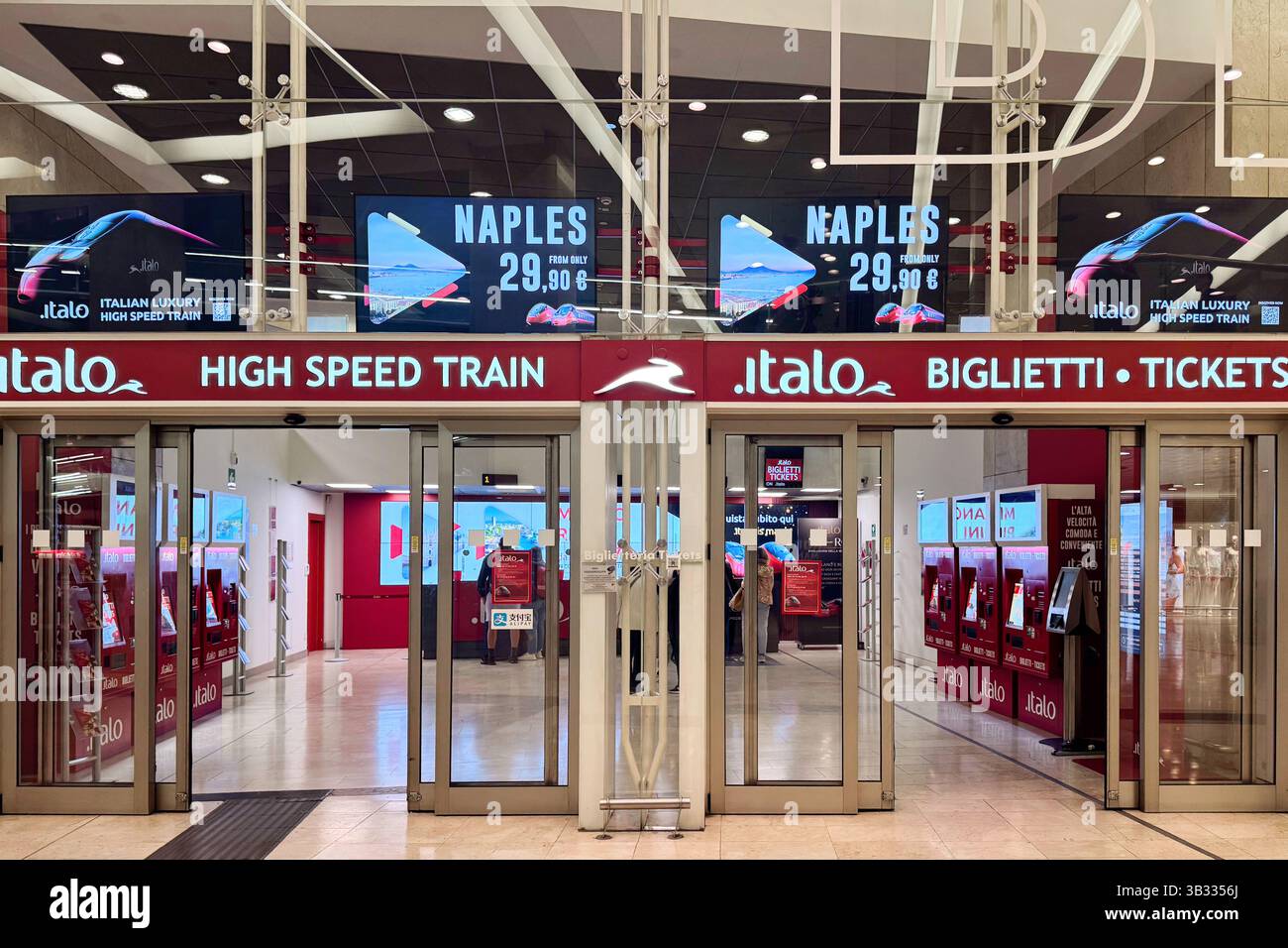 Milan, Italy - April, 07, 2025: Italo train ticket area in Milan. Red ...