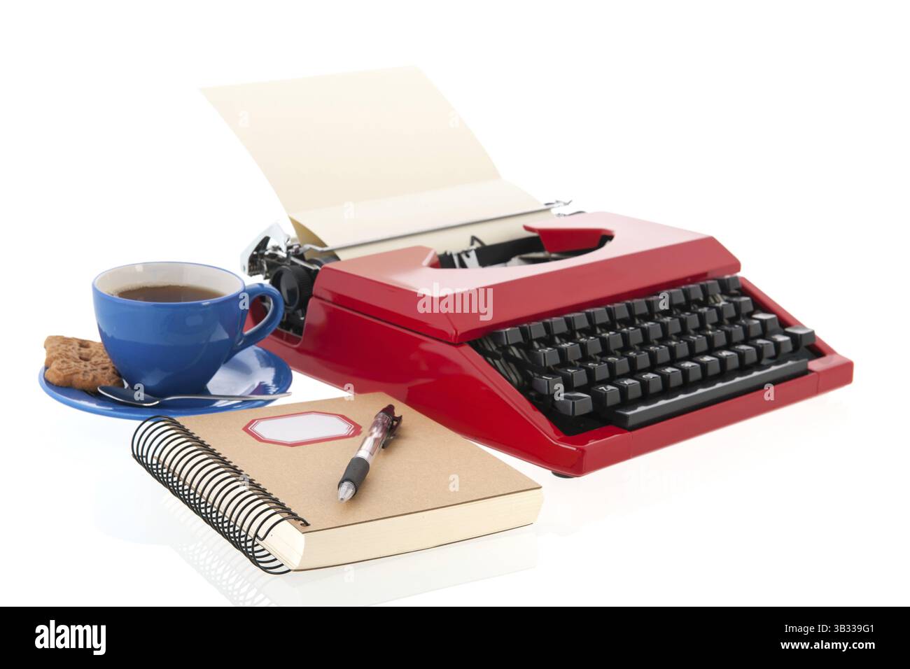 Vintage red typewriter with blank paper isolated over white background ...