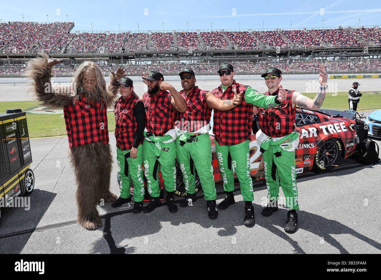TALLADEGA, AL - APRIL 27: Sasquatch clowns around with the crew members ...
