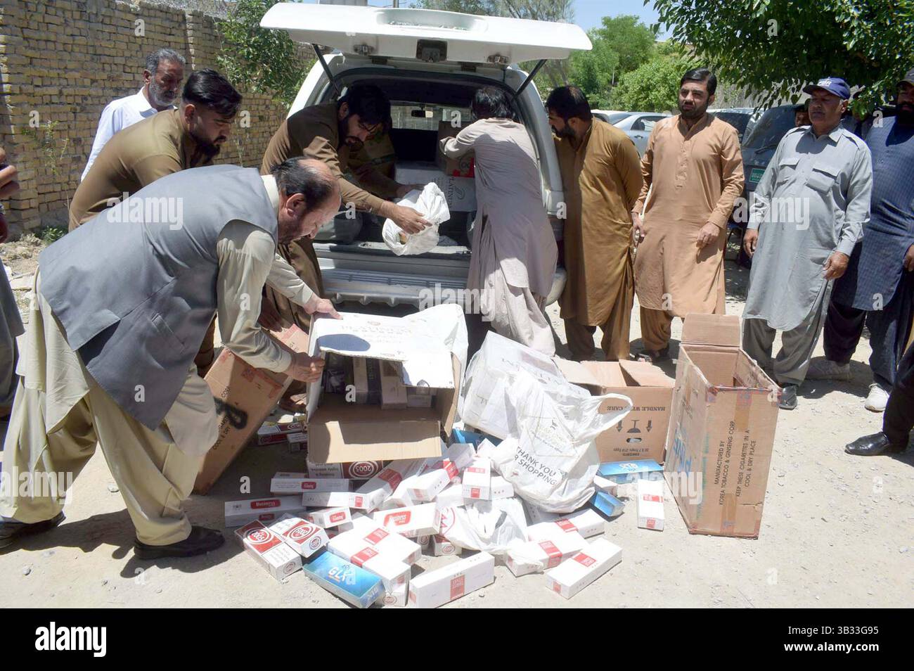 View of burning pile of confiscated drugs, cigarettes and others goods ...