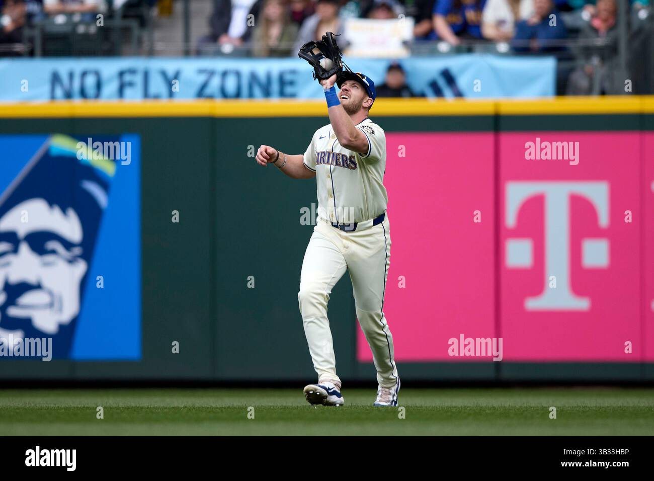 Seattle Mariners right fielder Luke Raley catches a fly ball hit by a ...