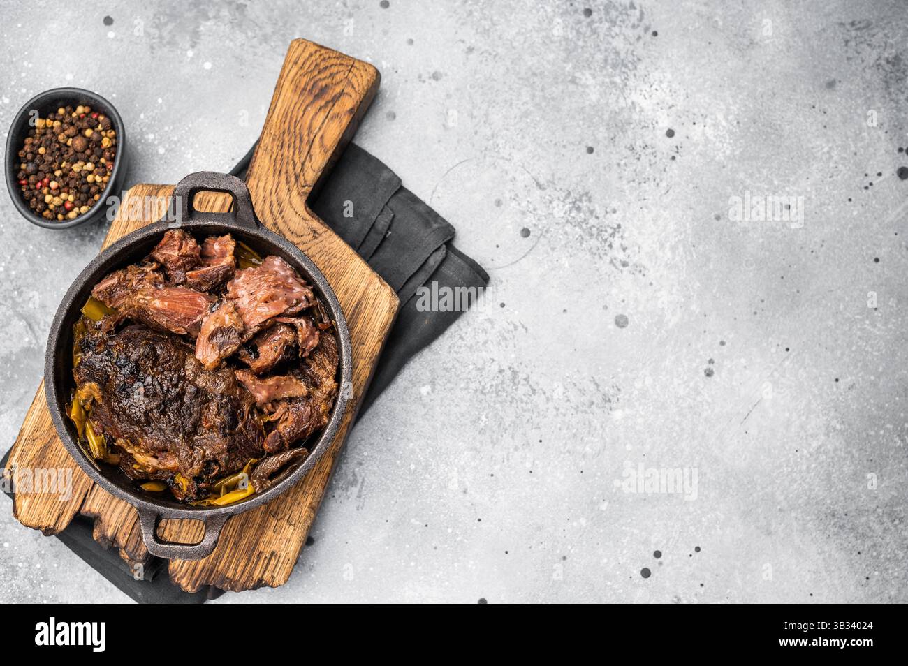 Red Wine Braised Beef Cheek meat with Creamy sauce in a skillet. grey ...